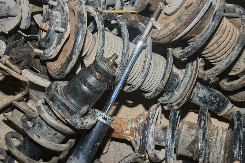 Shock Absorber and Coil Spring Pile on Ground Stock Photo - Image of ...