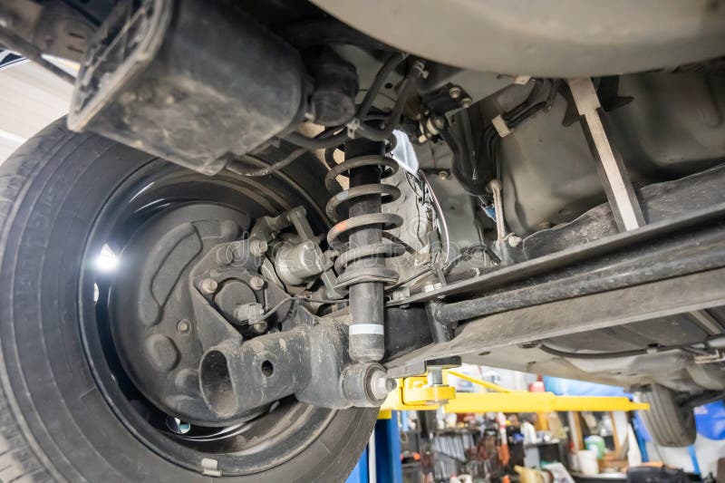Shock Spring Under a Car Tire. Stock Photo - Image of spring ...
