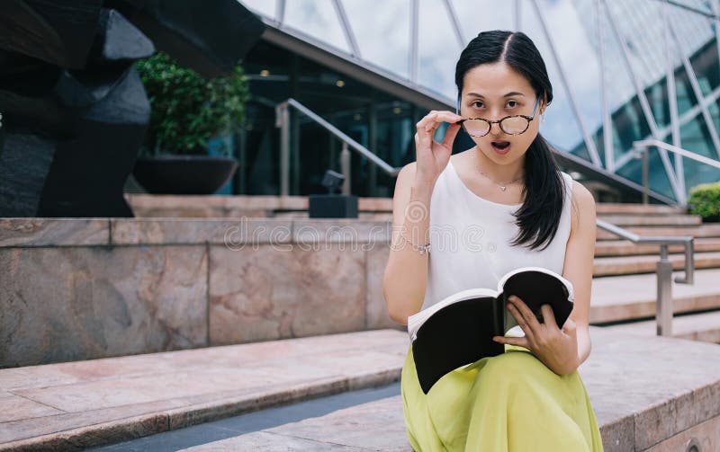 Shocked Asian Reader Looking at Camera on Street Stock Photo - Image of ...