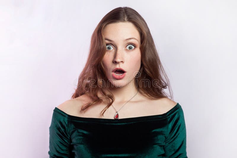 Shocked Astonished Woman Looking At Camera With Big Eyes And Open Mouth