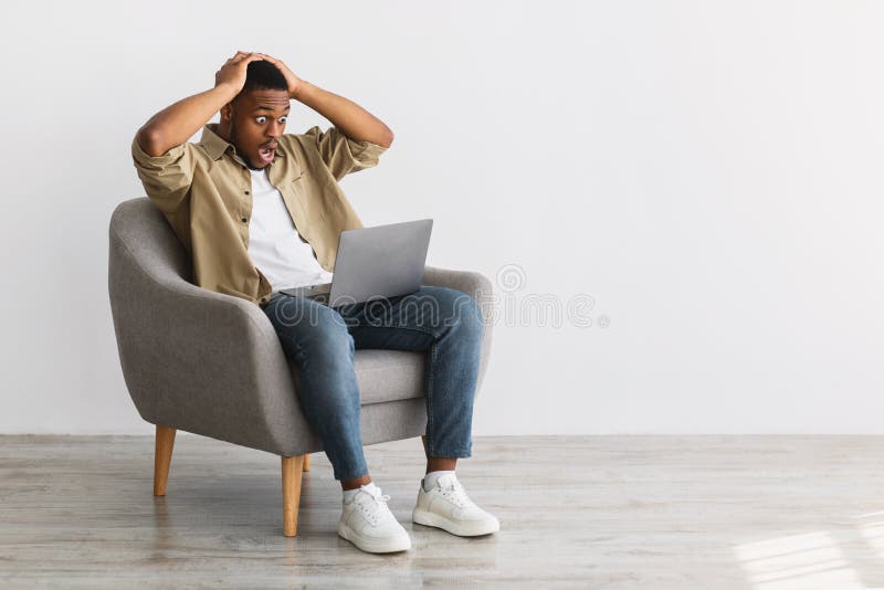 Shocked Black Man Looking at Laptop Having Problem, Gray Background ...