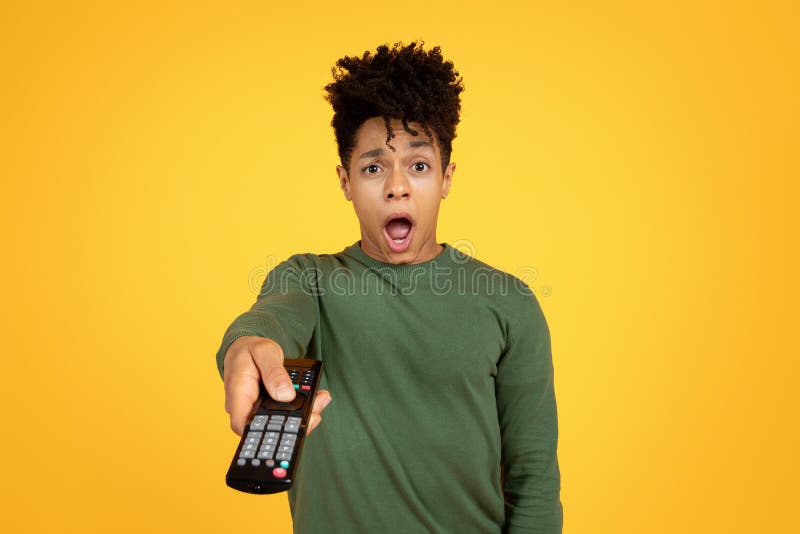Shocked Black Man with a Remote Control Stock Photo - Image of casual ...