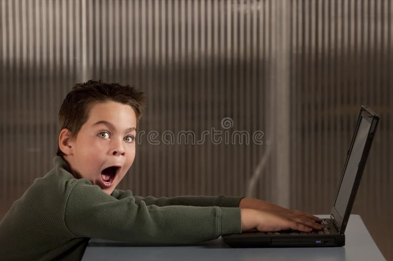 Shocked Boy with a Laptop Computer Stock Photo - Image of type, worry ...