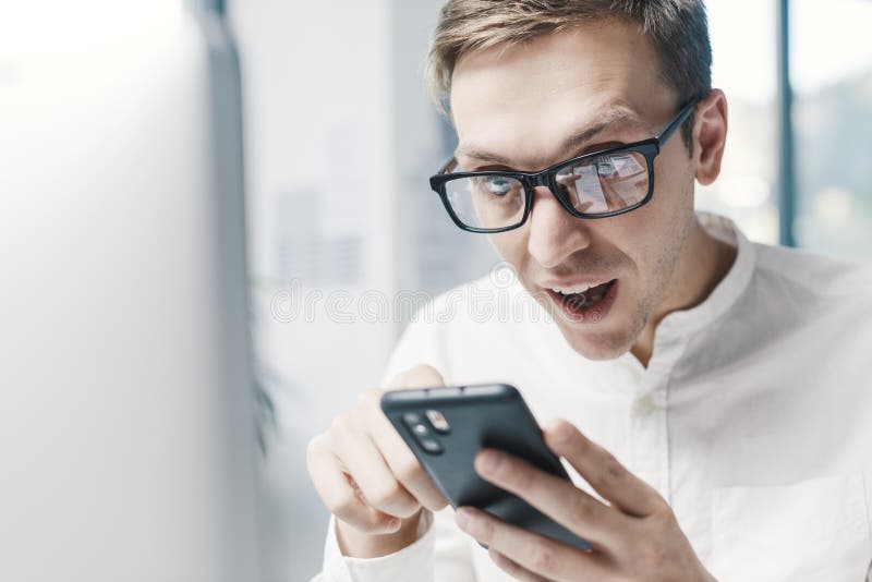 Shocked Businessman Connecting With His Smartphone Stock Image Image