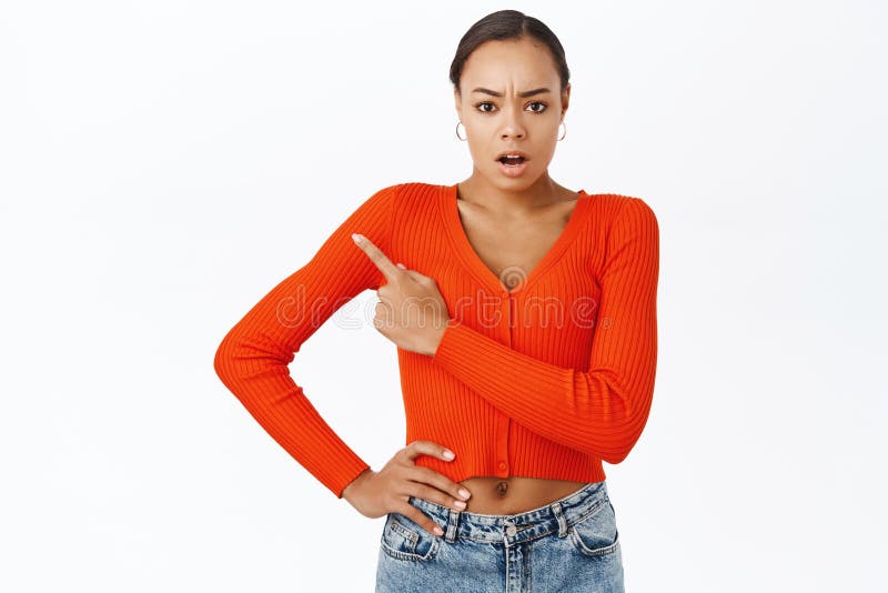 Shocked And Concerned African American Woman Pointing Finger At Upper