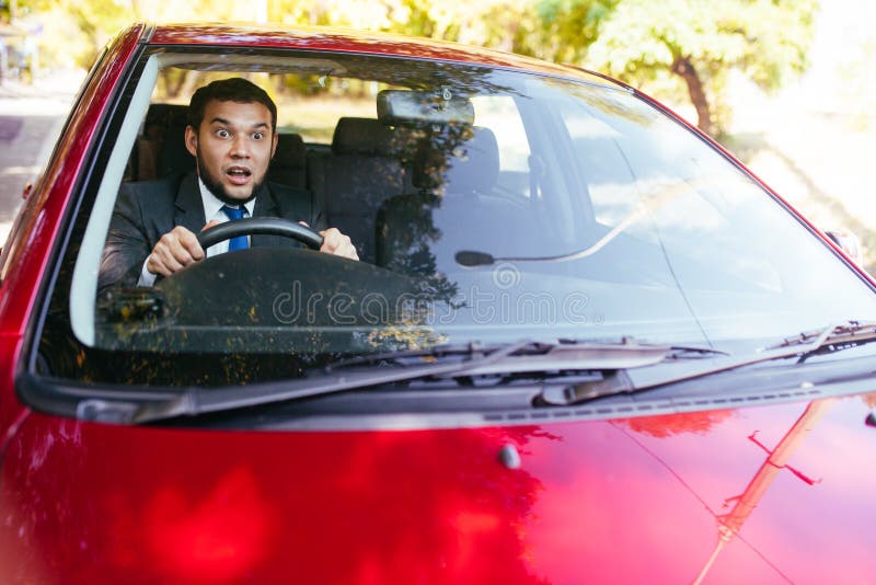 Shocked Driver in the Car, Frightened Man Driving. Stock Photo - Image ...