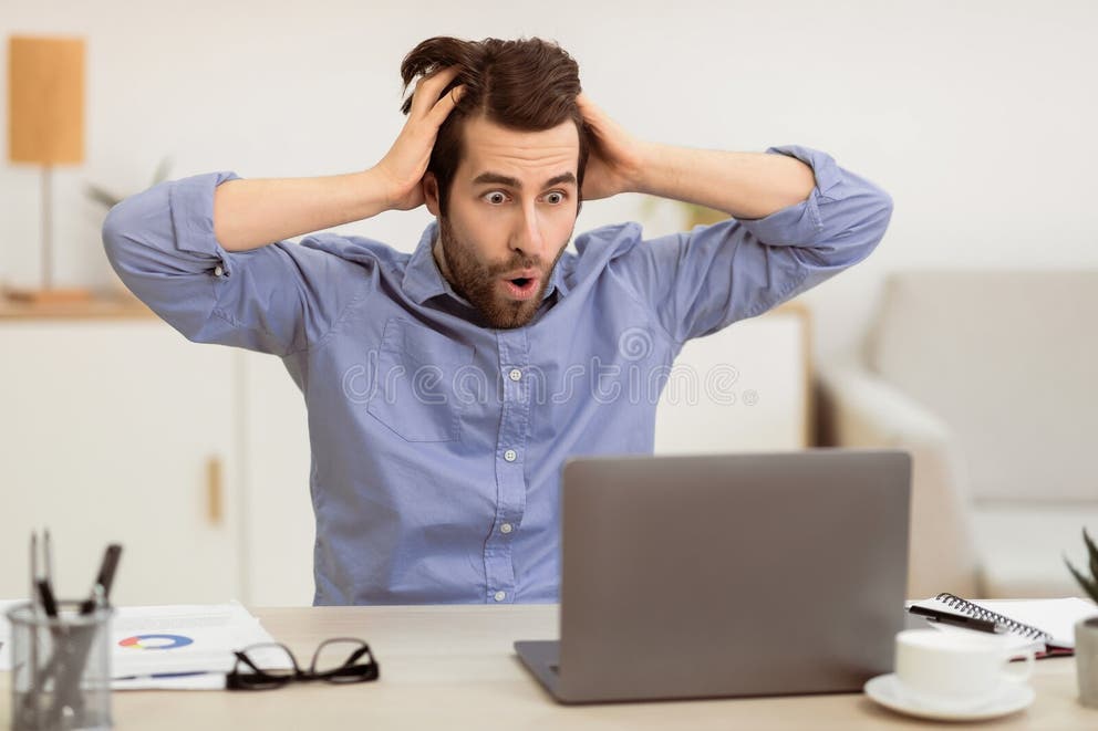 Shocked Frustrated Businessman Looking at Laptop Touching Head at ...