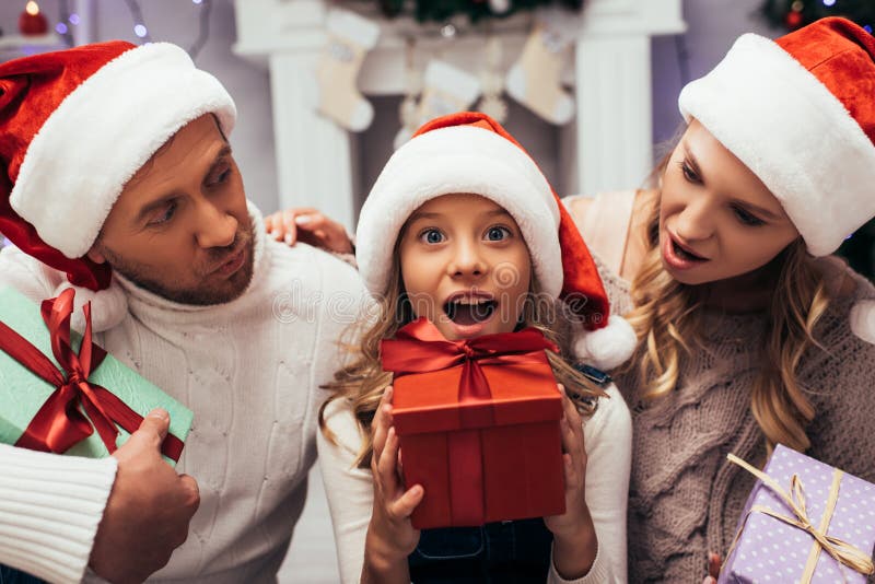 Shocked Kid Holding Christmas Present Near Stock Photo - Image of ...