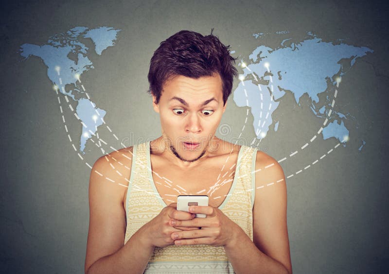 Shocked Man Looking at Smart Phone with World Map on Background Stock ...