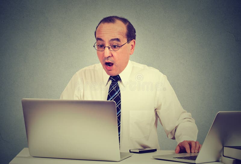 Shocked Man Sitting in Front of Laptop Computer Stock Image - Image of ...