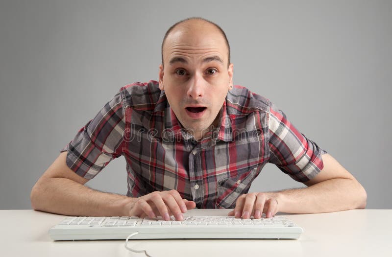 Shocked man using keyboard stock photo. Image of student - 38305810