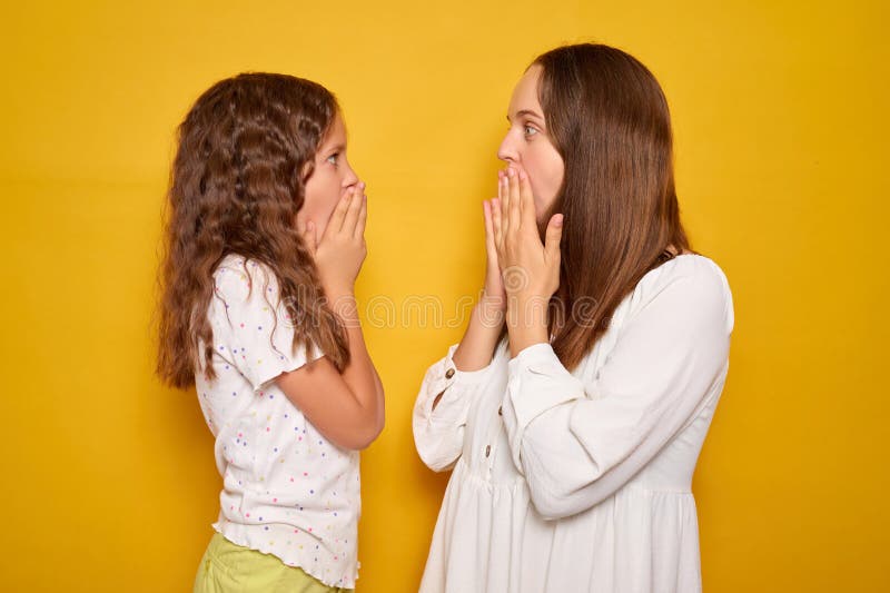 Shocked Mom And Daughter Expressing Disbelief And Excitement With