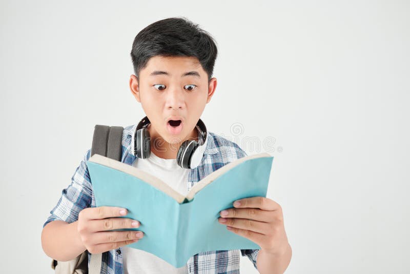 Shocked Schoolboy Reading Book Stock Image - Image of child, female ...