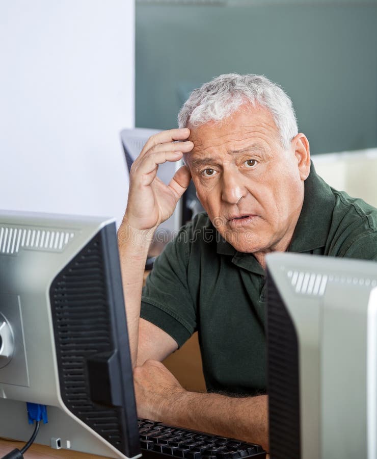 Shocked Senior Man at Computer Desk in Classroom Stock Image - Image of ...