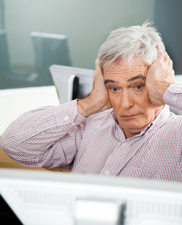Shocked Senior Man Looking at Computer in Classroom Stock Image - Image ...