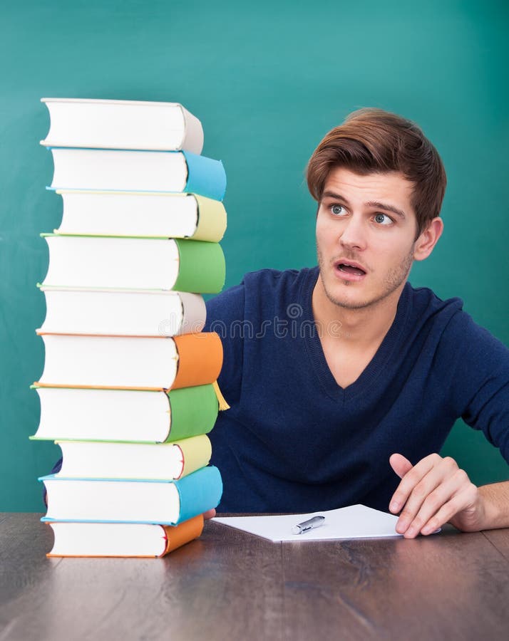 Shocked Student Looking at Books Stock Photo - Image of books ...