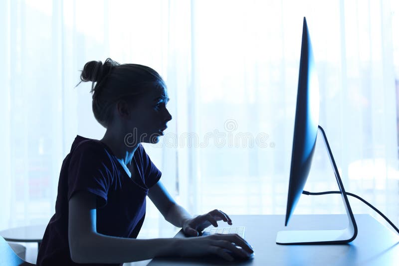 Shocked Teenage Girl Using Computer at Table. Danger of Internet Stock ...
