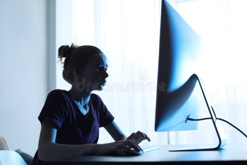 Shocked Teenage Girl Using Computer at Table. Danger of Internet Stock ...
