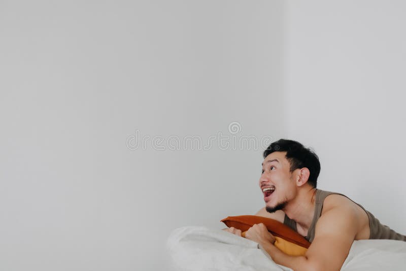 Shocked and Wow Face Man Point at the Empty Space while Lying on ...