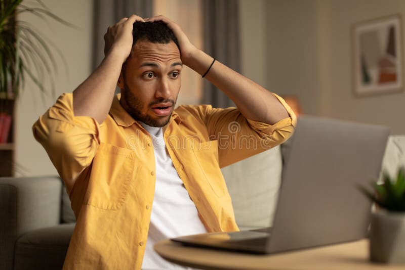 Shocked Black Guy Looking at Laptop Screen, Grabbing Head in Terror ...