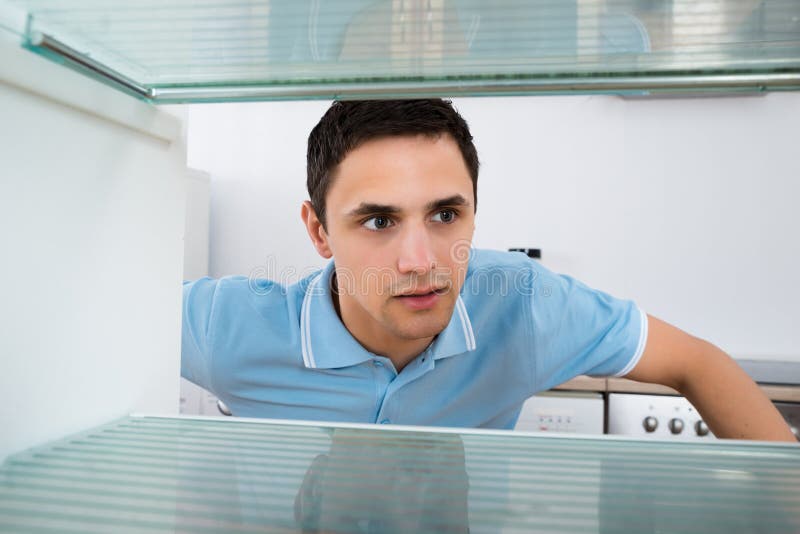Shocked Man Looking into Empty Refrigerator Stock Photo - Image of ...