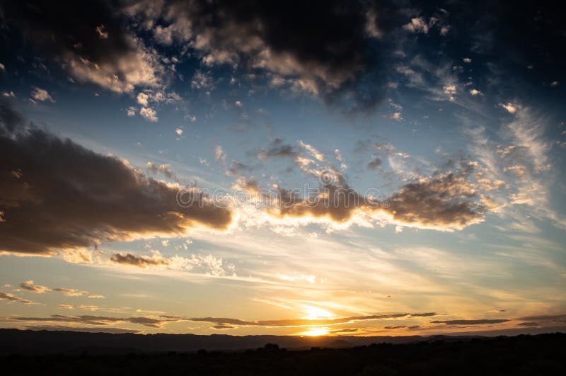 Shocking Sunset between the Field. Landscape with Distant Mountains ...