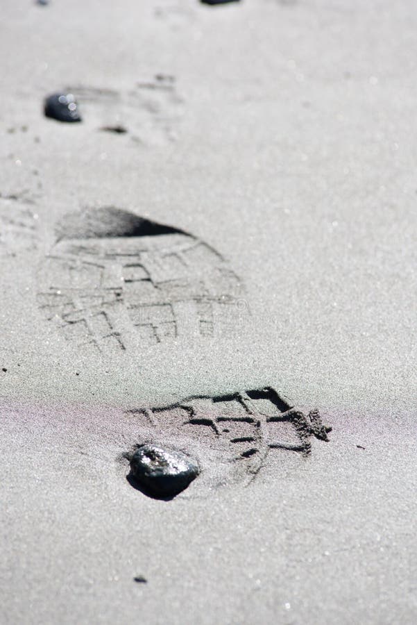 Shoe prints in the sand stock image. Image of footprints - 62615253