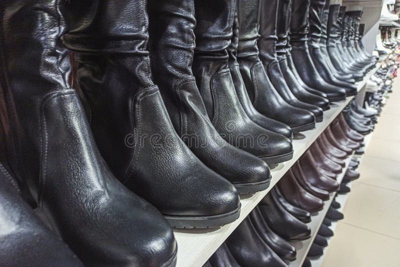 Shoe Shop Leather Boots Collection on Shelves Stock Photo - Image of ...