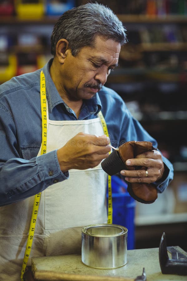 Shoemaker Applying Glue on Shoe Stock Photo - Image of craftsmanship ...