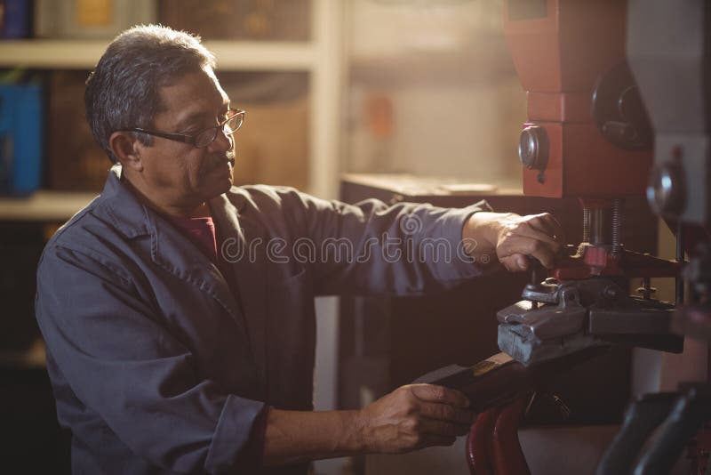 Shoemaker Making Shoe on Machine Stock Photo - Image of mixedrace ...