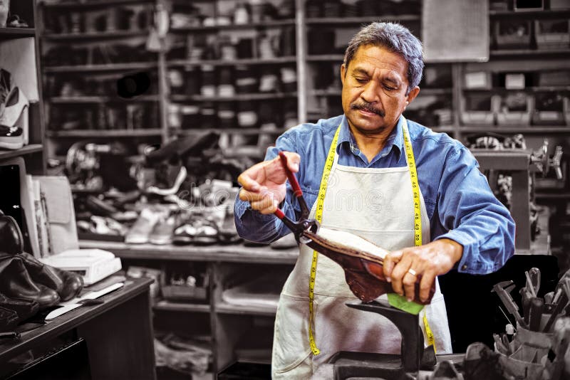 Shoemaker repairing a shoe stock photo. Image of clothing - 131717704
