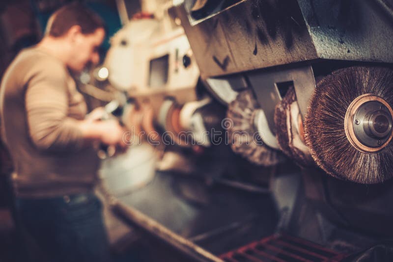 Shoemaker Repairs Shoes in Studio Craft Grinder Machine. Stock Photo ...