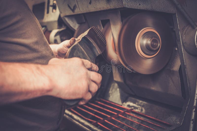 Shoemaker Repairs Shoes in Studio Craft Grinder Machine. Stock Photo ...