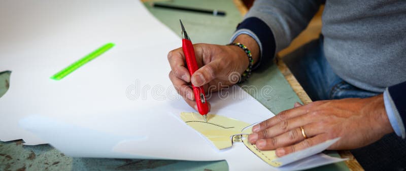 Shoe Designer Working with Paper Models for Leather Cutting Stock Photo ...