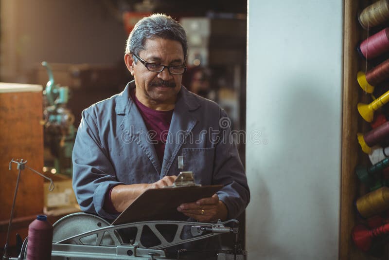 Shoemaker Writing on Clipboard Stock Image - Image of person, male ...