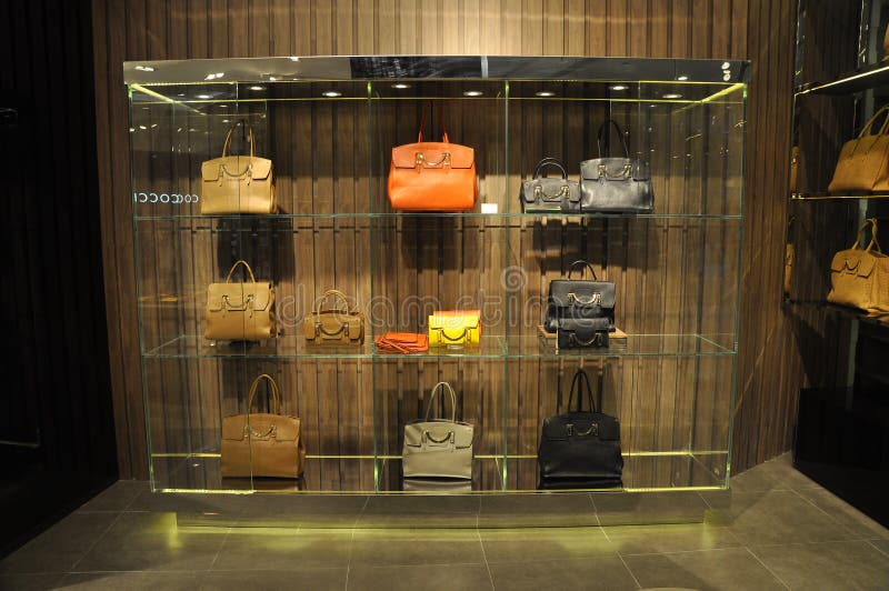 Shoes and bags in store editorial stock image. Image of buying - 56680829