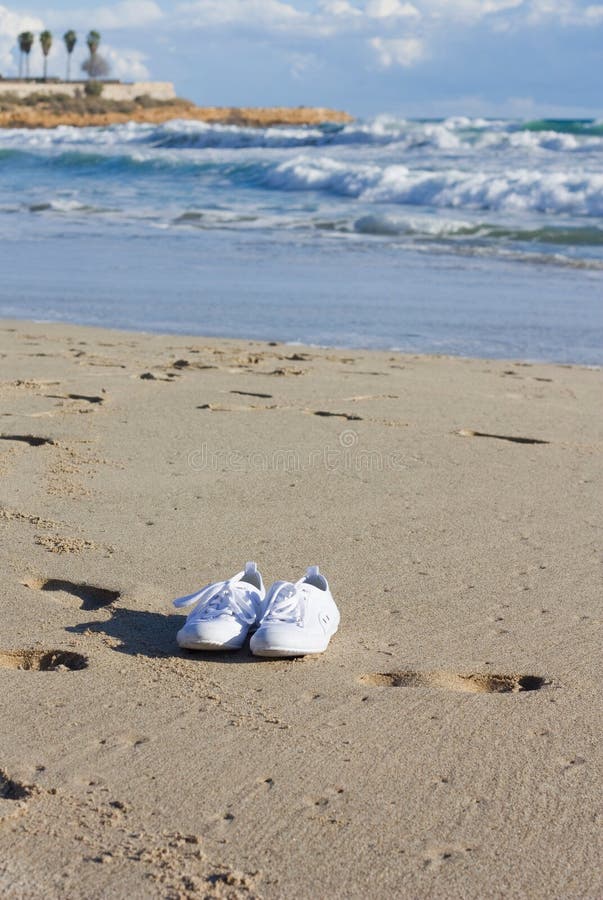 Shoes on the beach stock photo. Image of vacation, summer - 16926588