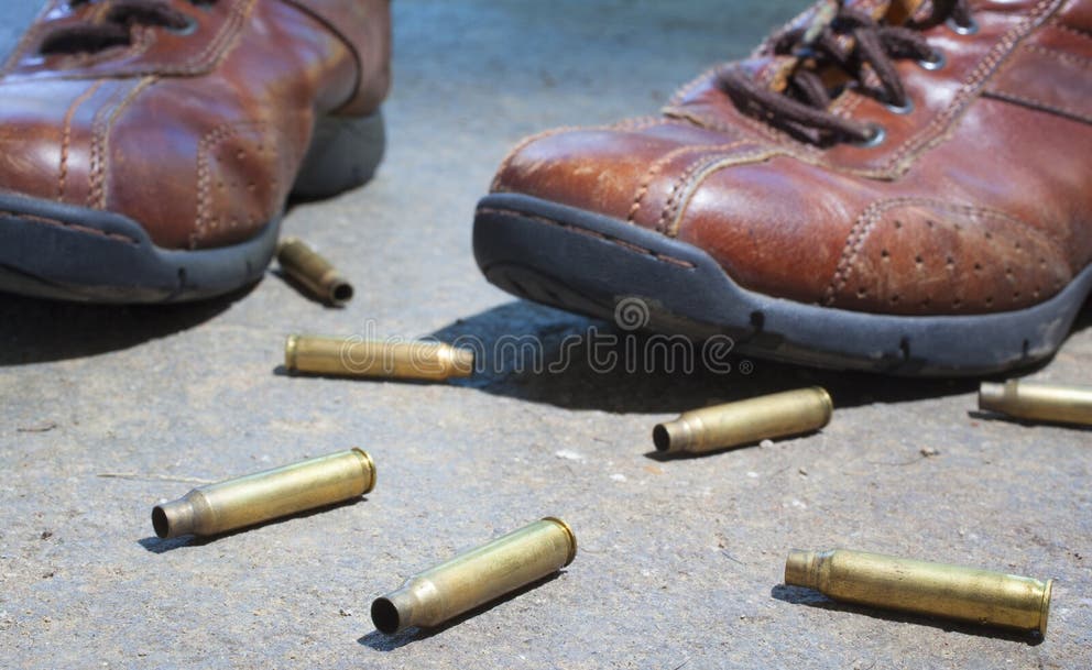 Shoes and bullets stock photo. Image of scene, leather - 60977972