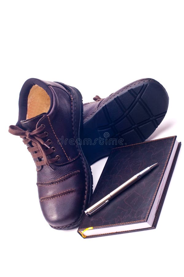 Shoes and notebook stock image. Image of trekking, business - 22911813