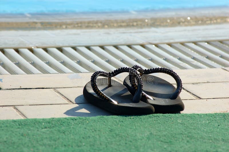 Shoes By Pool stock photo. Image of float, shoe, flipflop - 794452