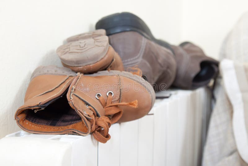 Shoes on radiator stock image. Image of battery, macro - 38913489