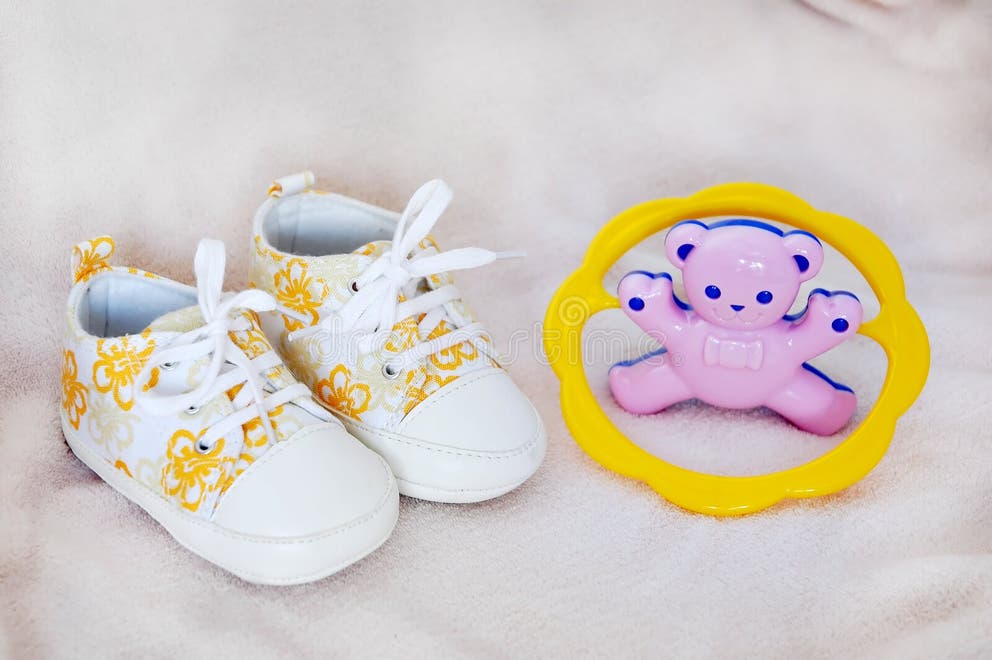 Shoes and rattle stock photo. Image of booty, background - 11283956