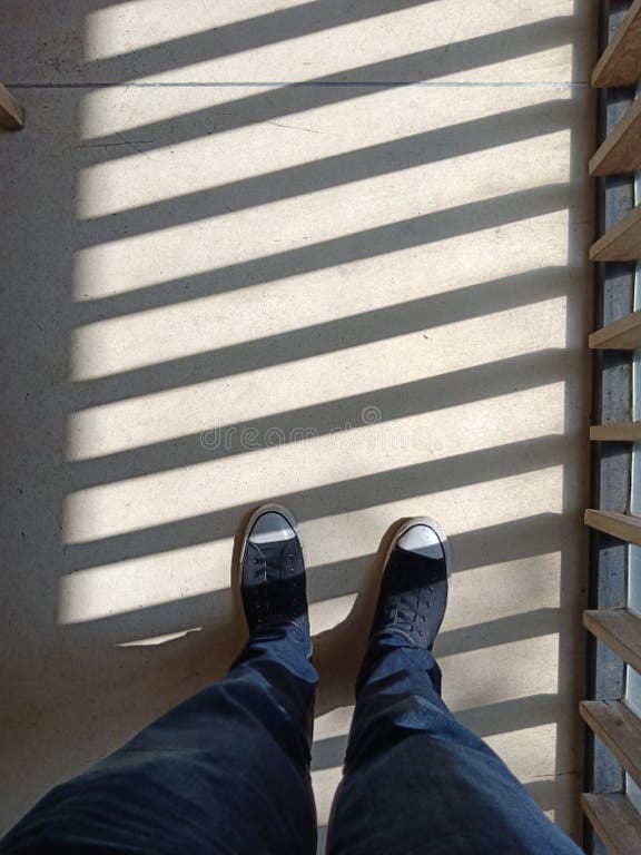 Shoes in the shadow stock image. Image of striped, shadow - 219134645