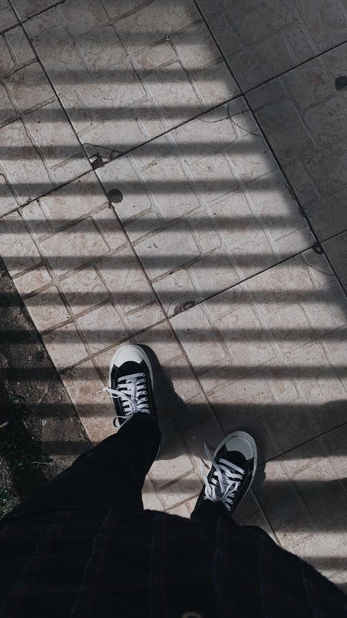 Shoes and Shadow in the Morning Stock Photo - Image of shoes, shadow ...