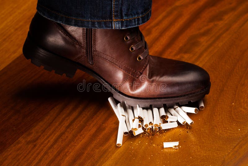 Shoes Trampling Down on Cigarettes Stock Image - Image of group ...