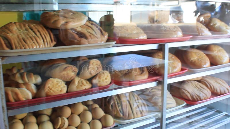Shoot Clips of a Bunch of Different Bread on Shelf Glass Tiny Store ...