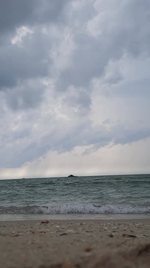 Shoot Vertical Video of Waves Hitting the Shore and Sandy Beach ...