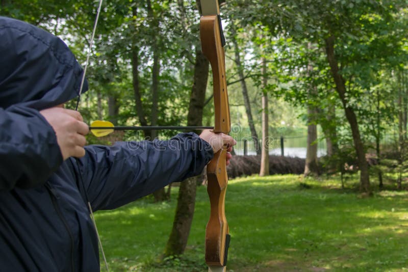 The Shooter in the Blue Hood, Pulls the Bow String, To Hit the Target ...