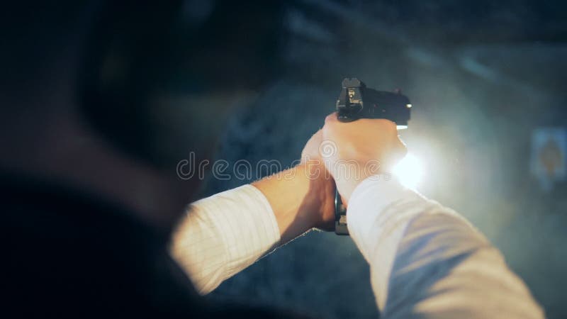 A Shooter Firing a Gun, Back View. Stock Video - Video of practice ...