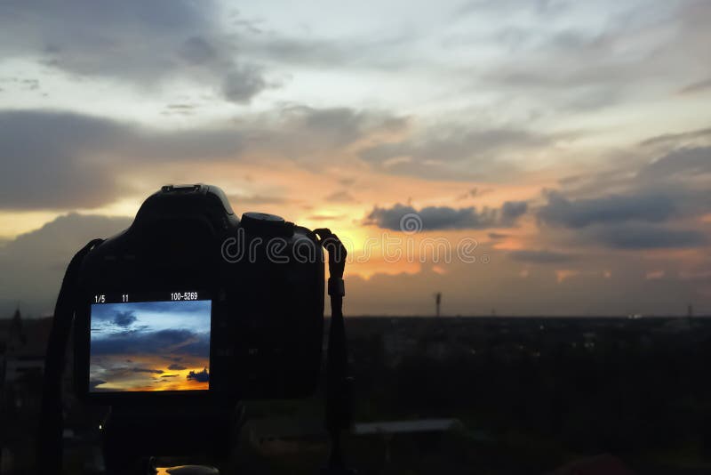 Shooting the Beautiful Sunset Sky.Focus on Camera. Stock Photo - Image ...